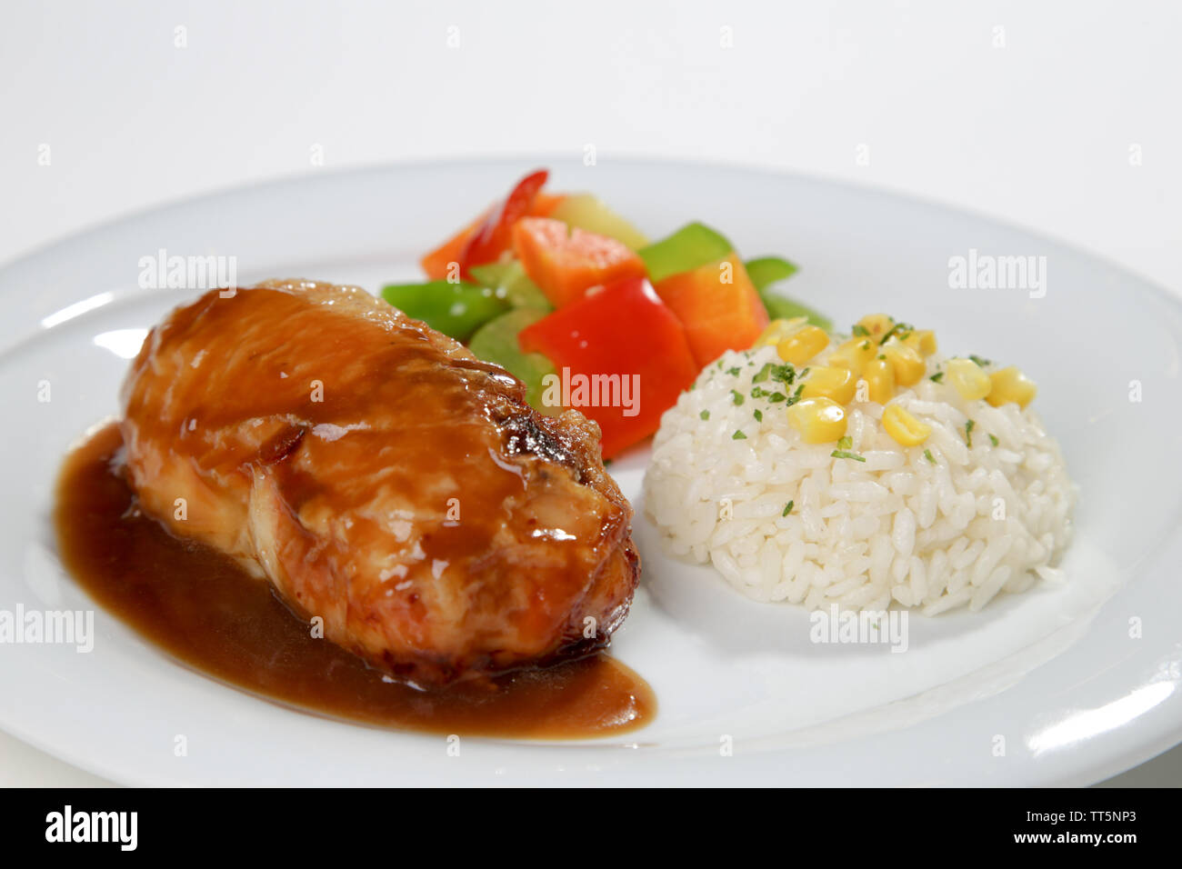 barbeque sauced chicken roll with side dish white background Stock ...