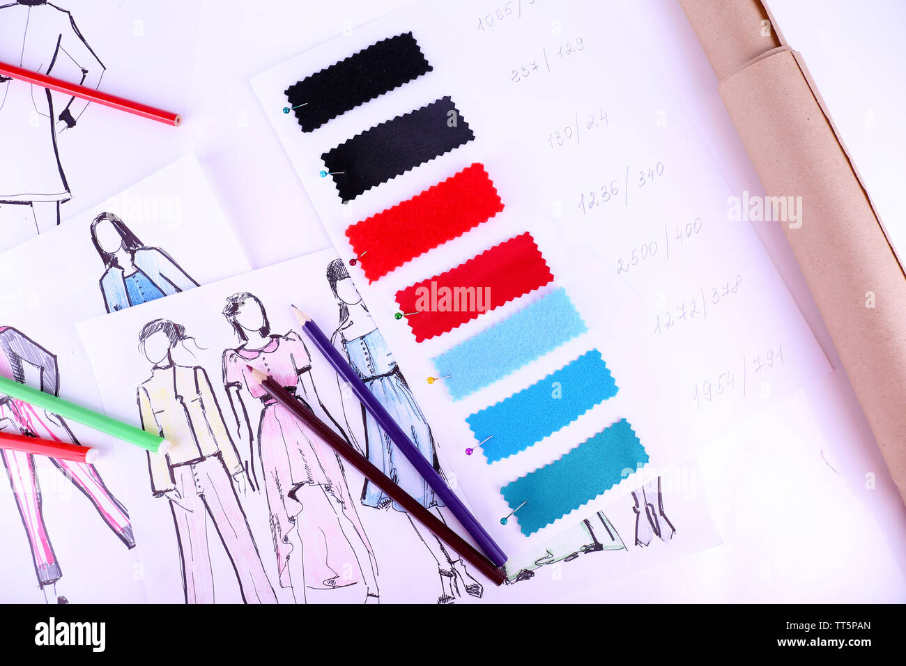 Sketches of clothes and fabric samples on table Stock Photo - Alamy