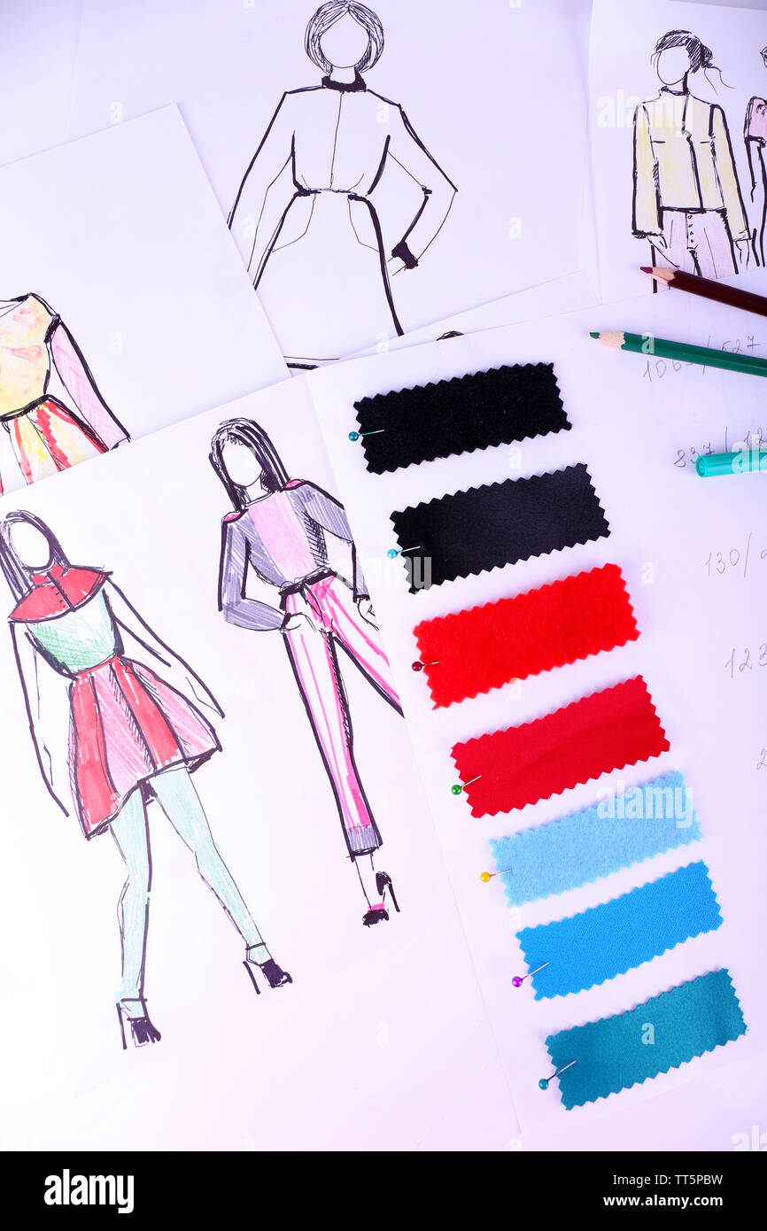 Sketches of clothes and fabric samples on table Stock Photo - Alamy