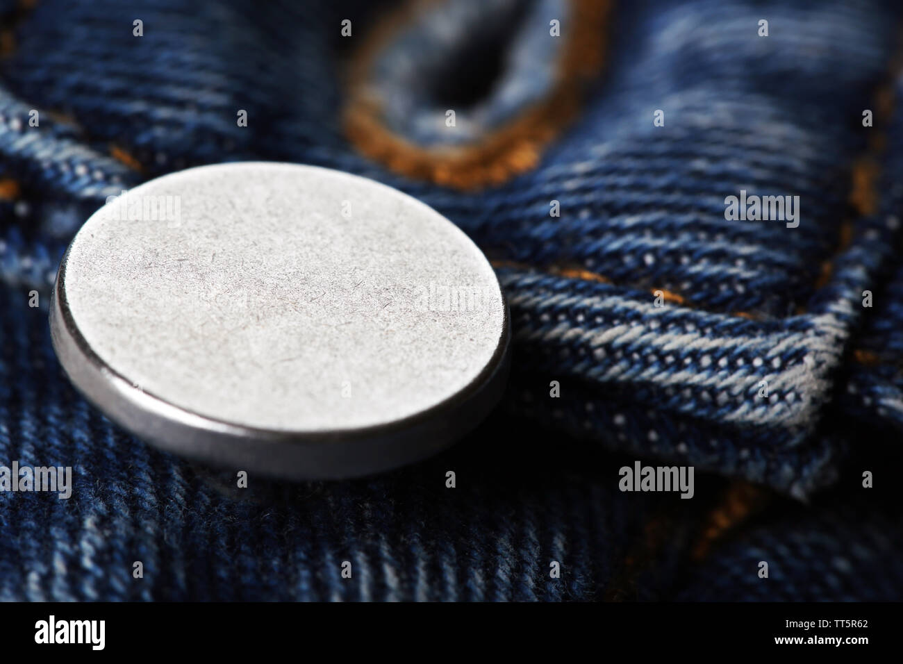 Button on clothes close up Stock Photo - Alamy