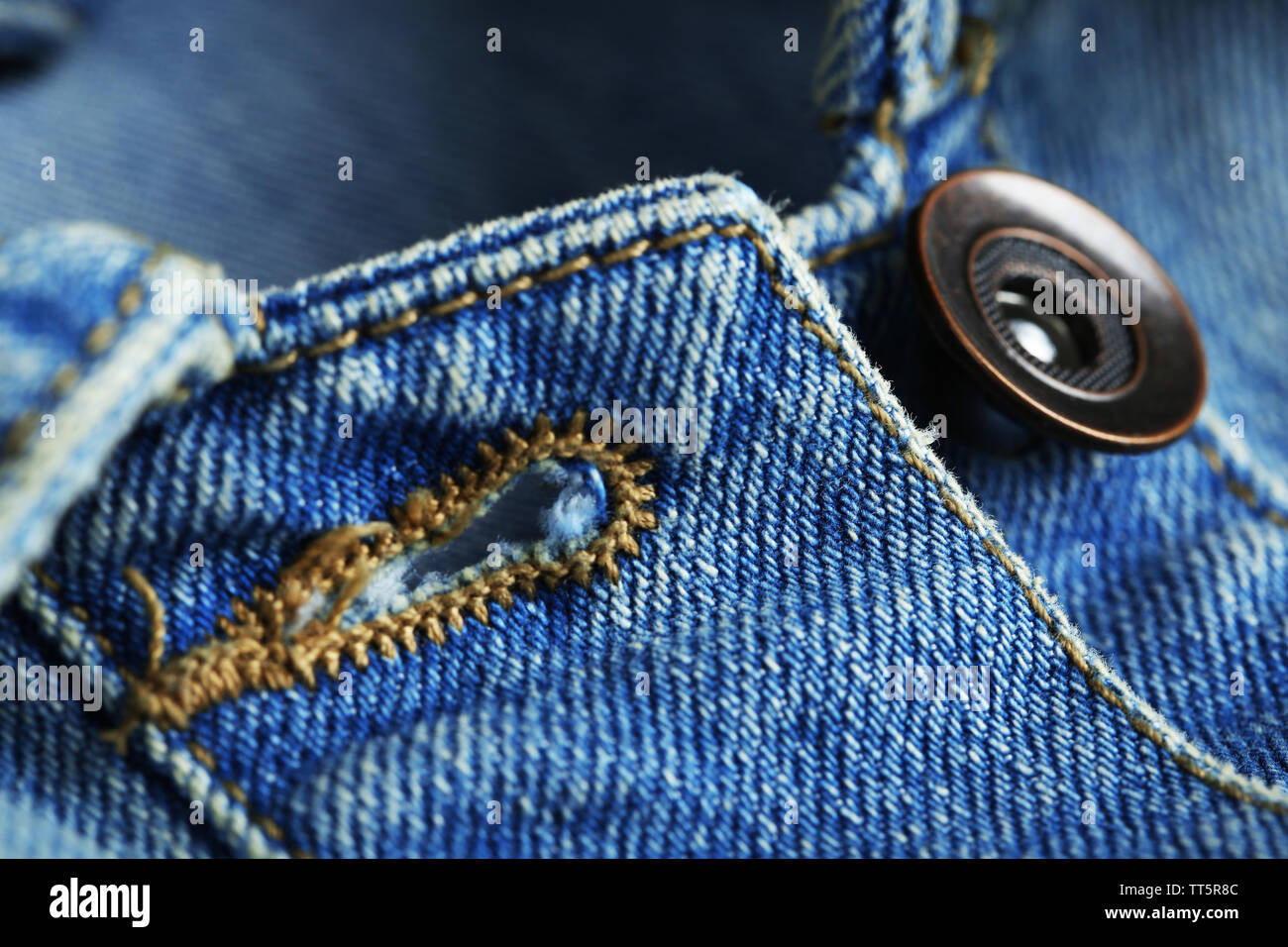Button on clothes close up Stock Photo - Alamy