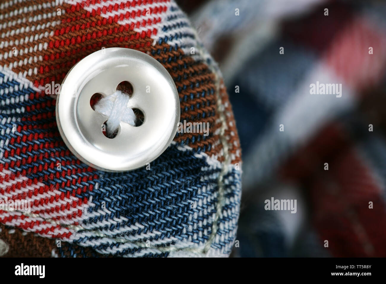 Button on clothes close up Stock Photo - Alamy