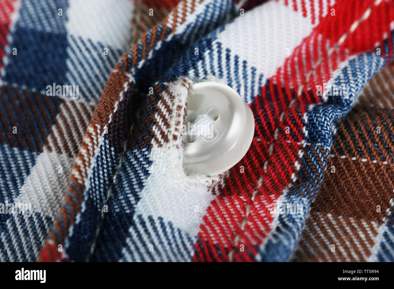 Button on clothes close up Stock Photo - Alamy