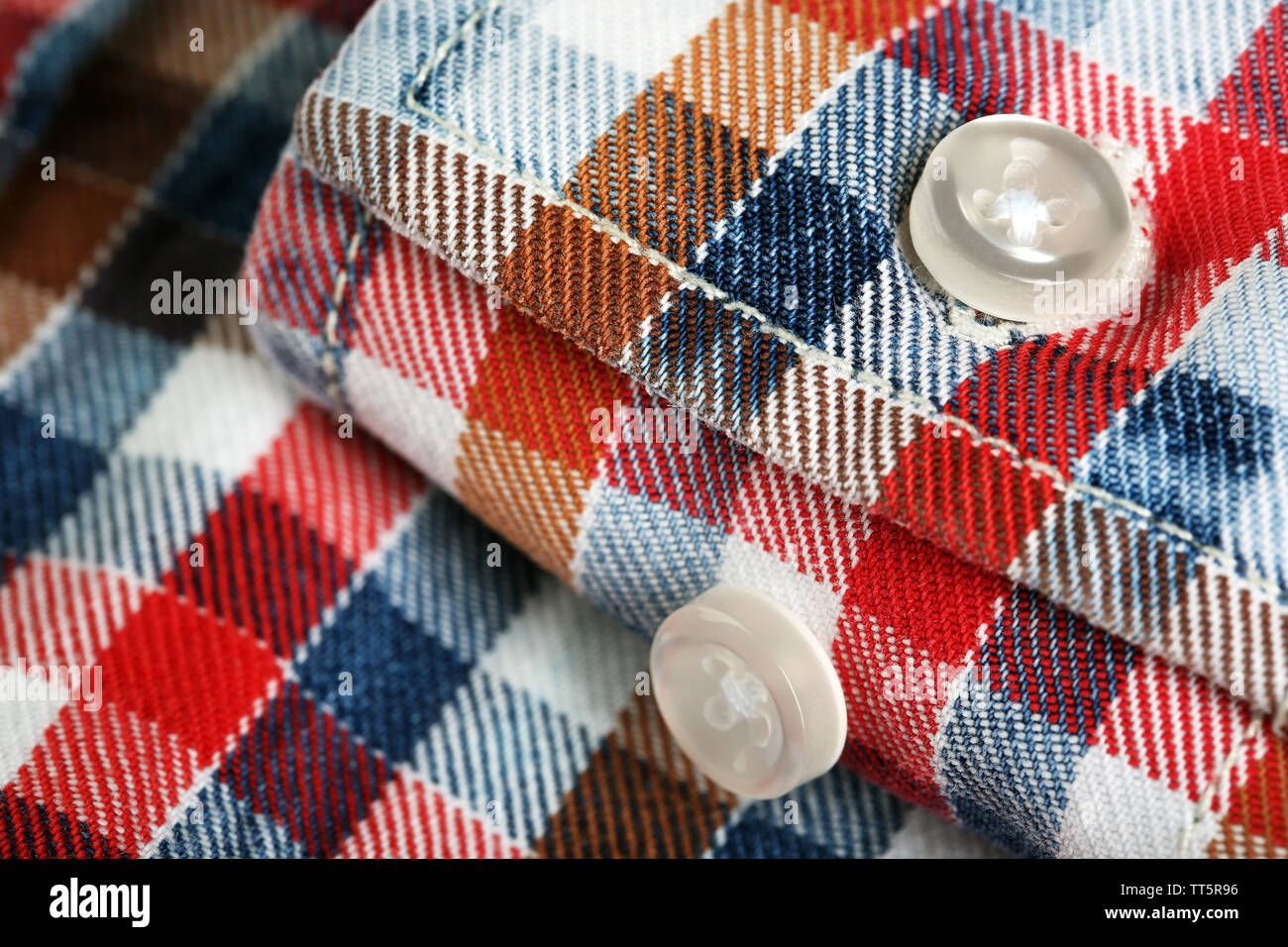 Buttons on clothes close up Stock Photo - Alamy