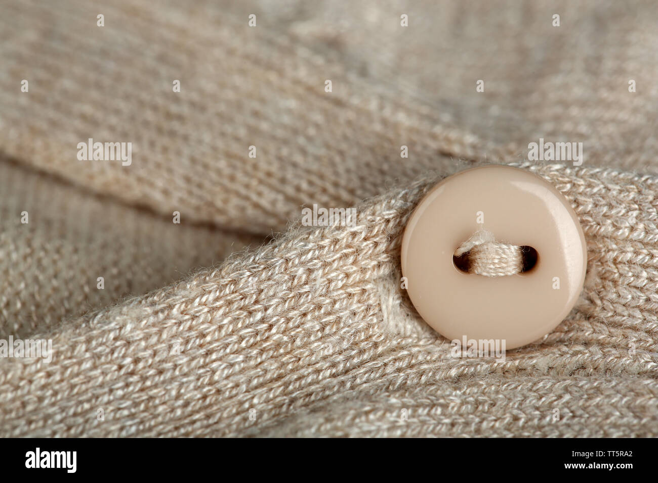 Button on clothes close up Stock Photo - Alamy
