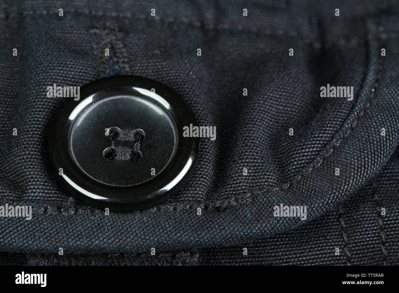 Button on clothes close up Stock Photo - Alamy