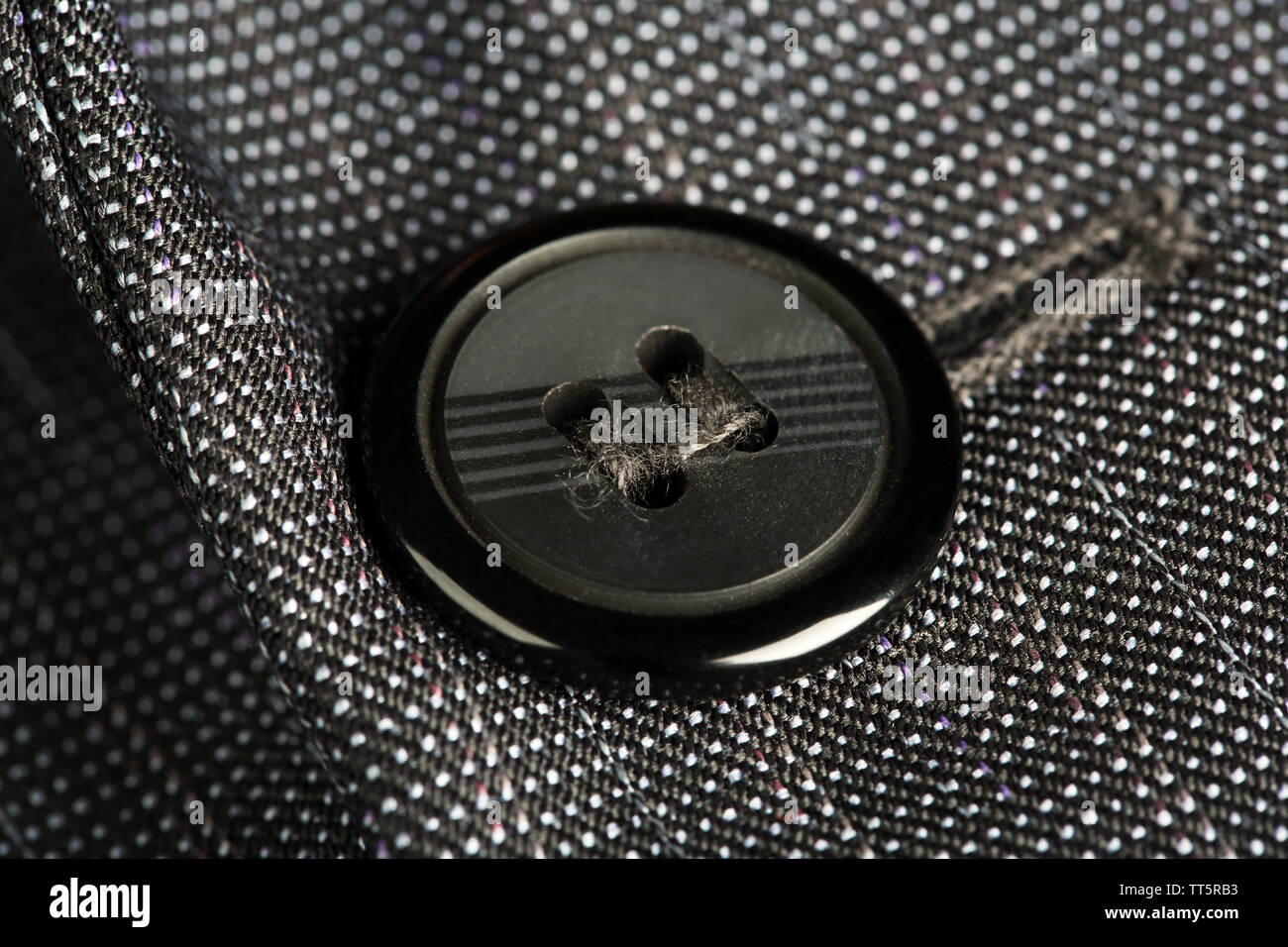 Button on clothes close up Stock Photo - Alamy