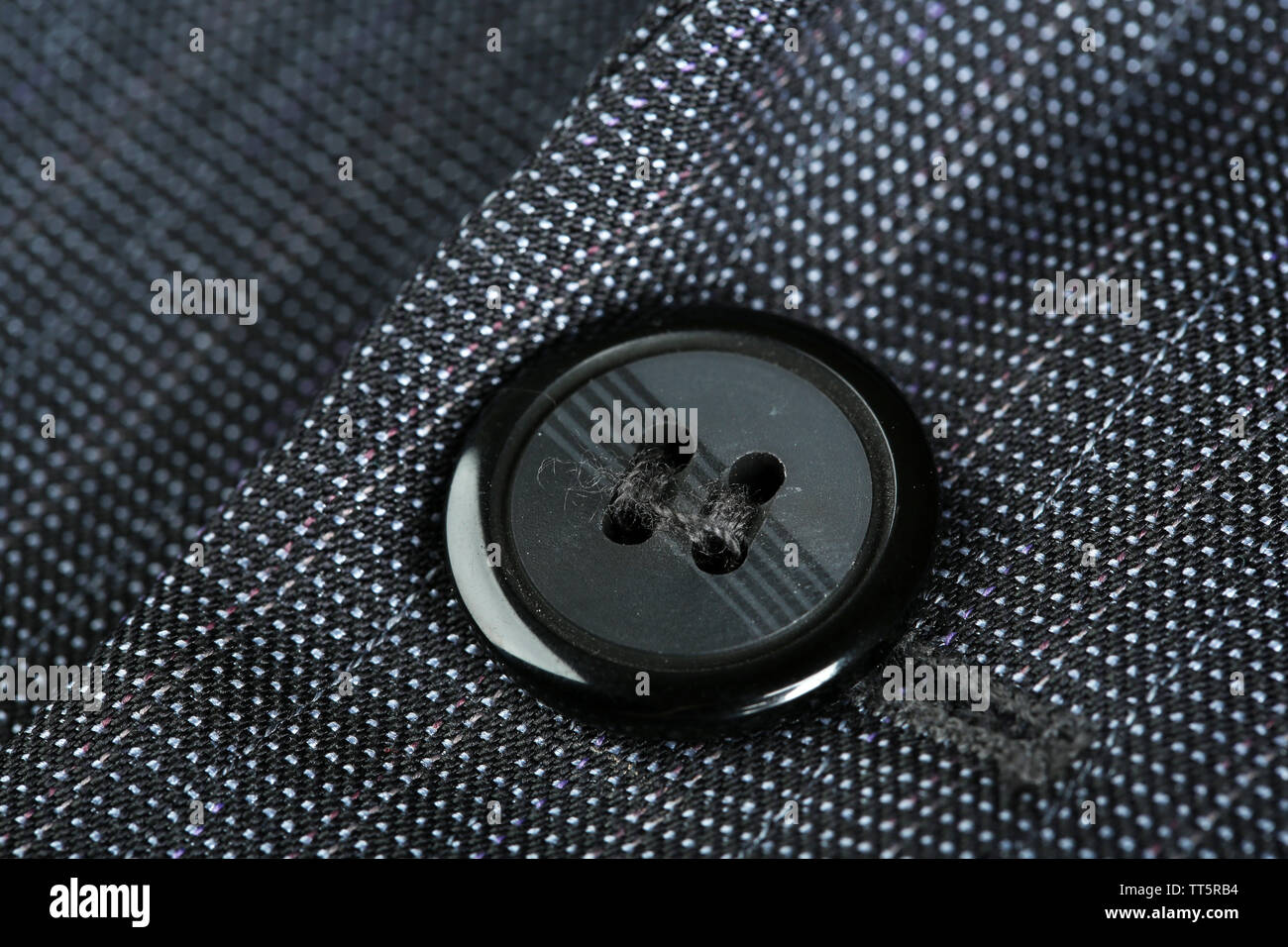 Button on clothes close up Stock Photo - Alamy