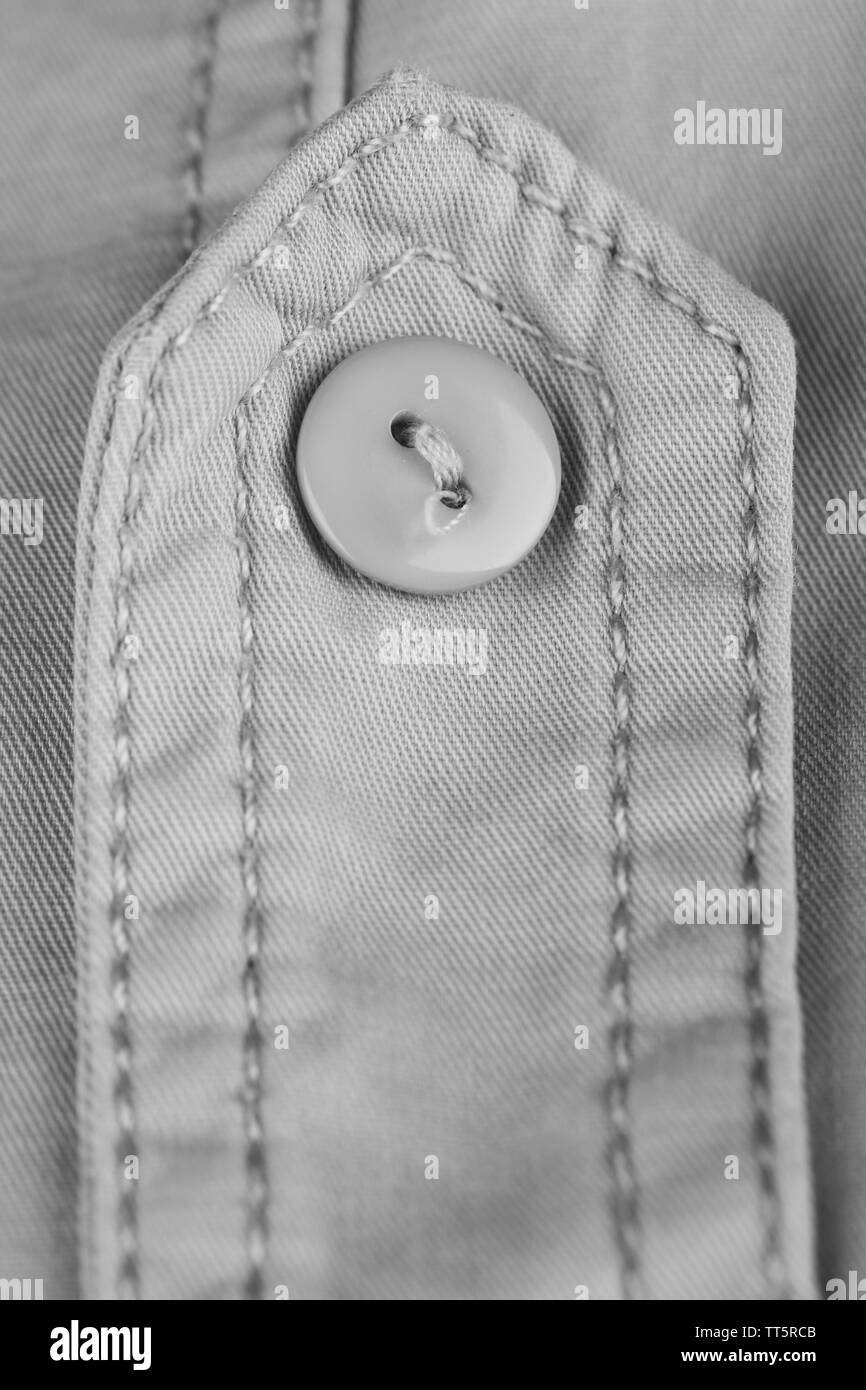 Button on clothes close up Stock Photo - Alamy