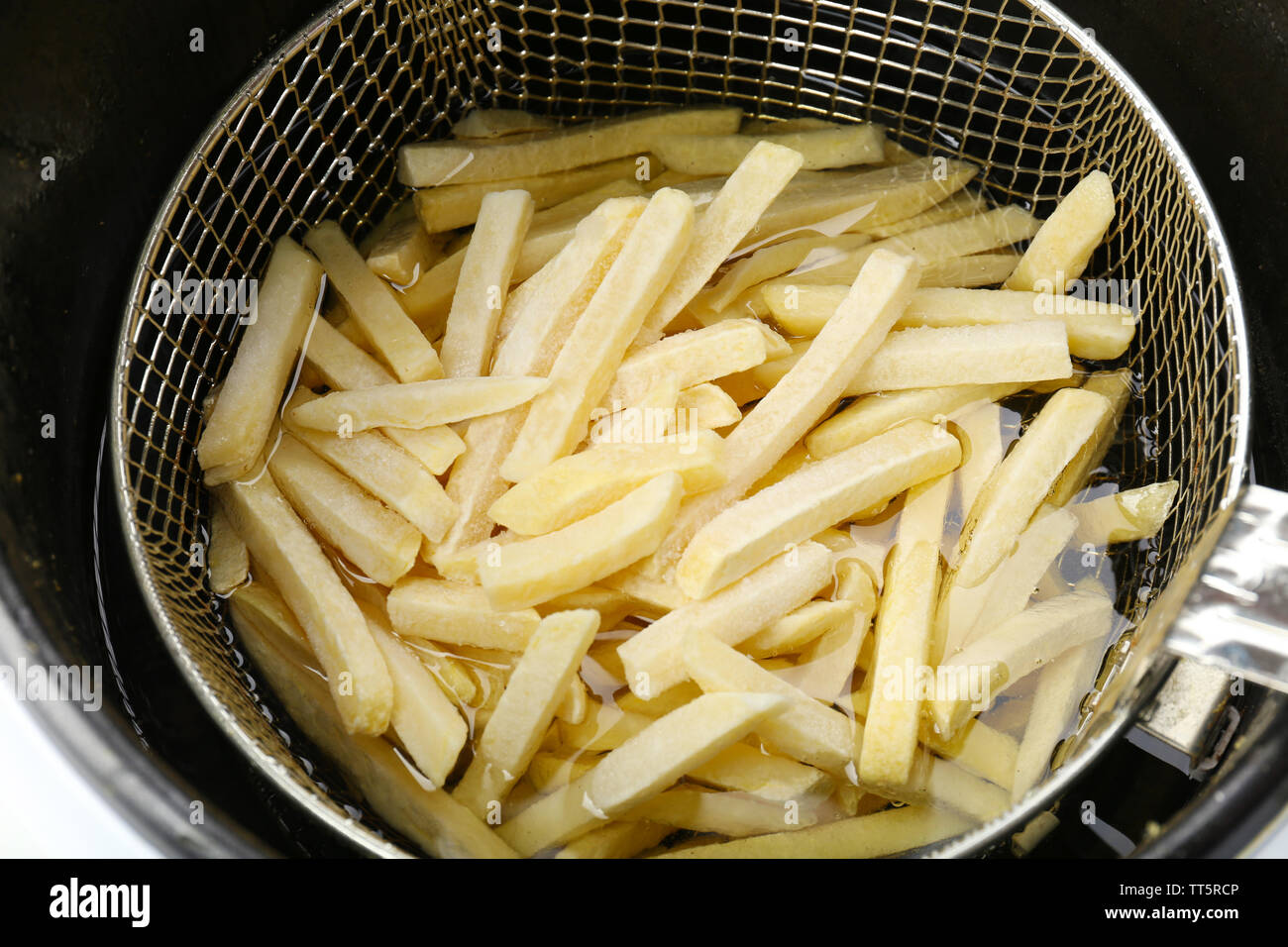 French fries in pan boiling hi-res stock photography and images - Alamy