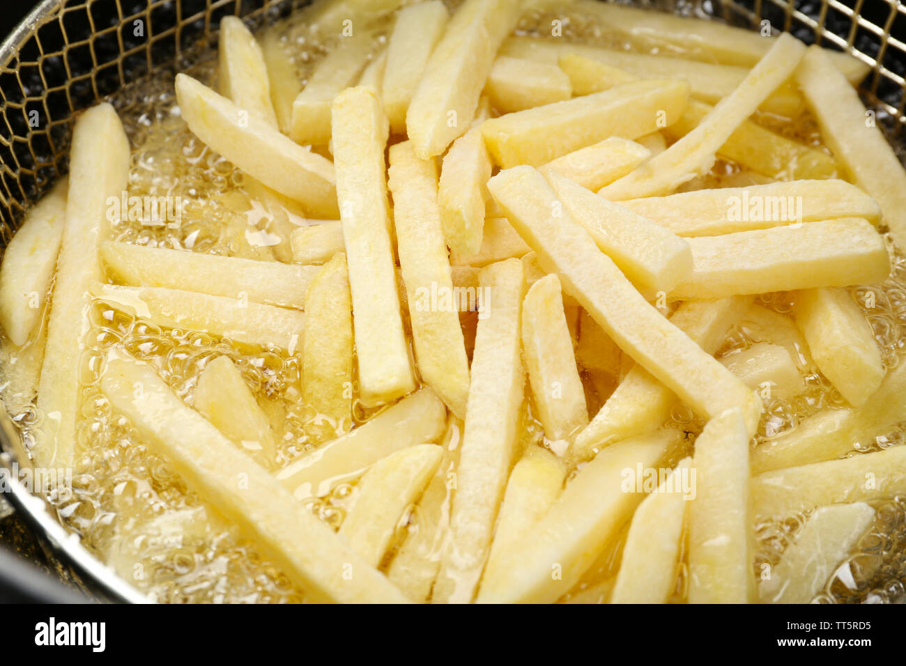 French fries in pan boiling hi-res stock photography and images - Alamy