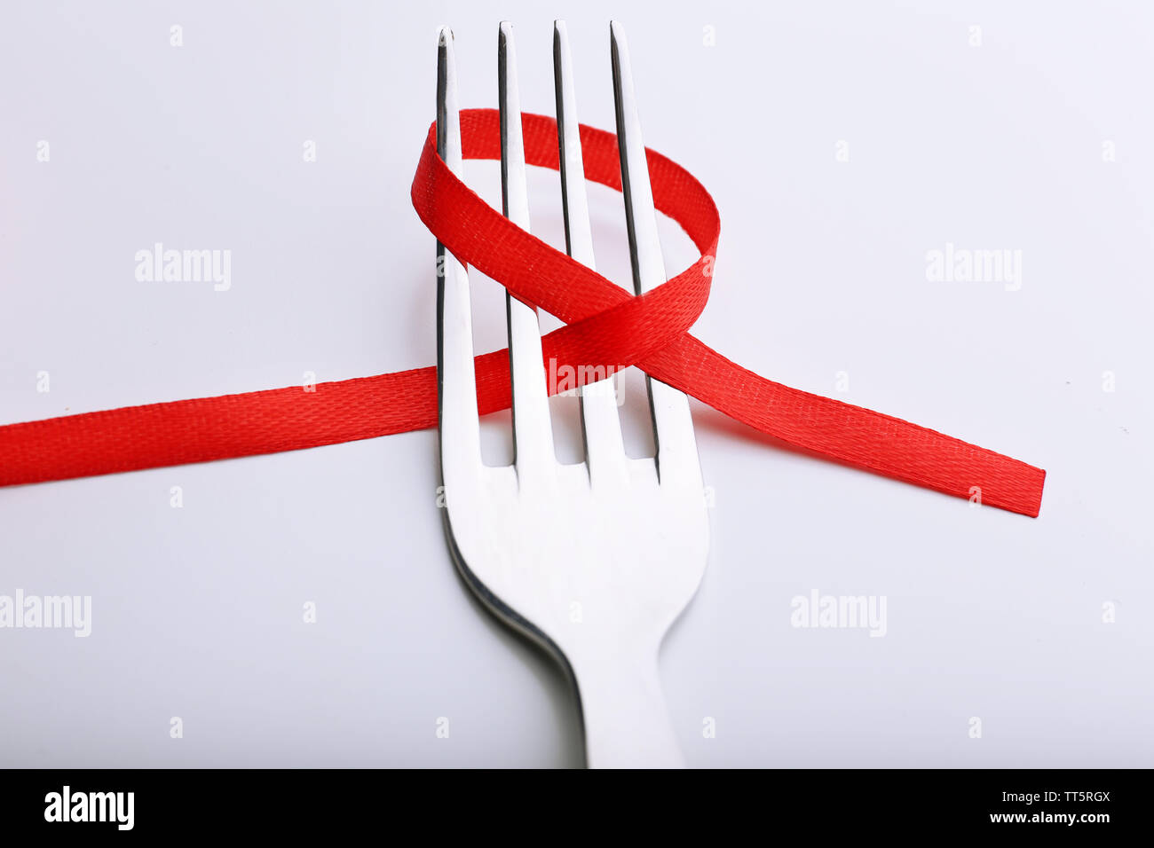 Stages of tying bow on fork, close-up Stock Photo - Alamy