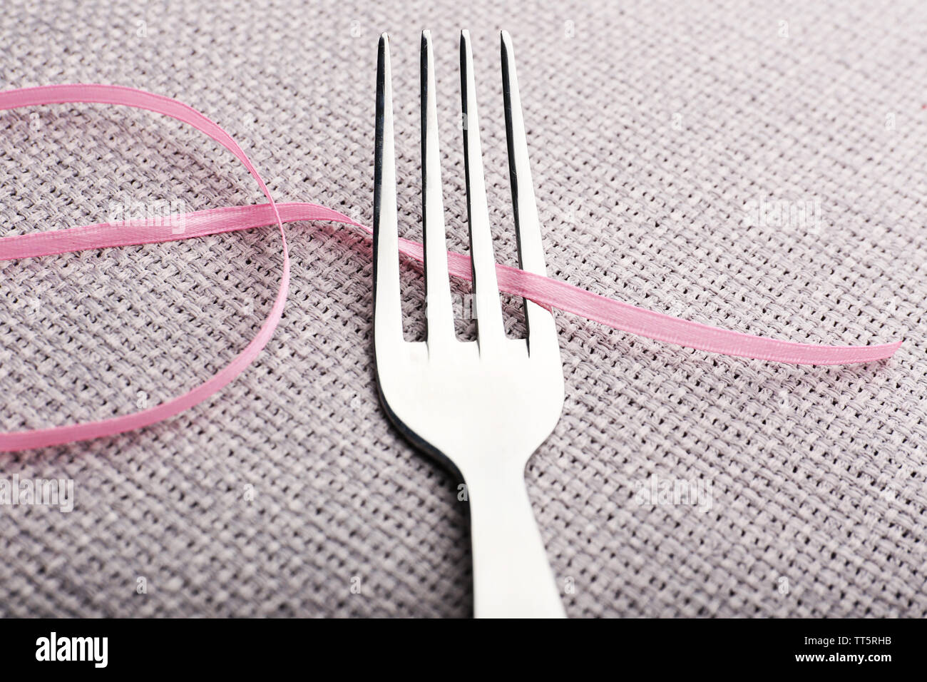 Stages of tying bow on fork, close-up Stock Photo - Alamy
