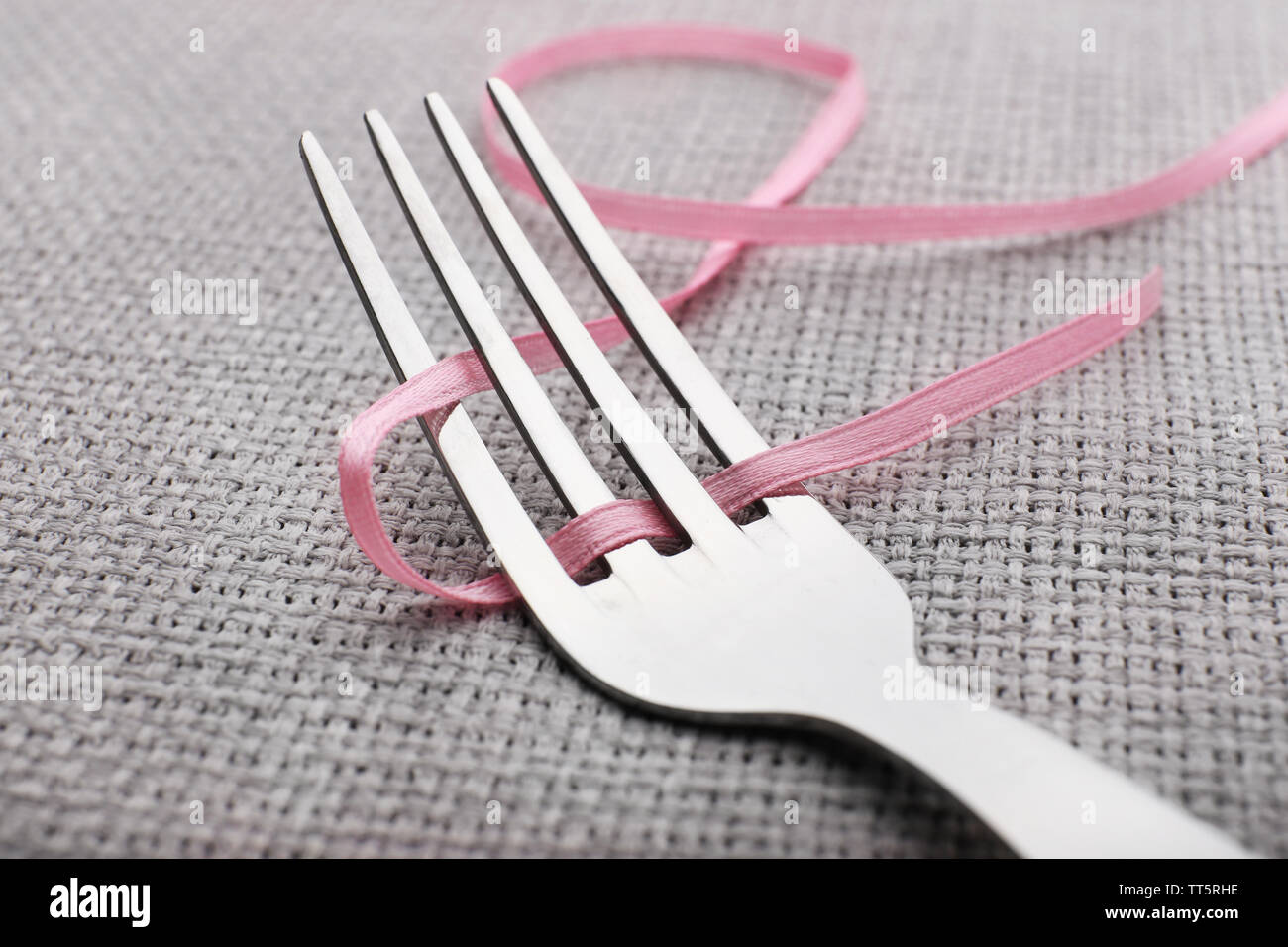 Stages of tying bow on fork, close-up Stock Photo - Alamy