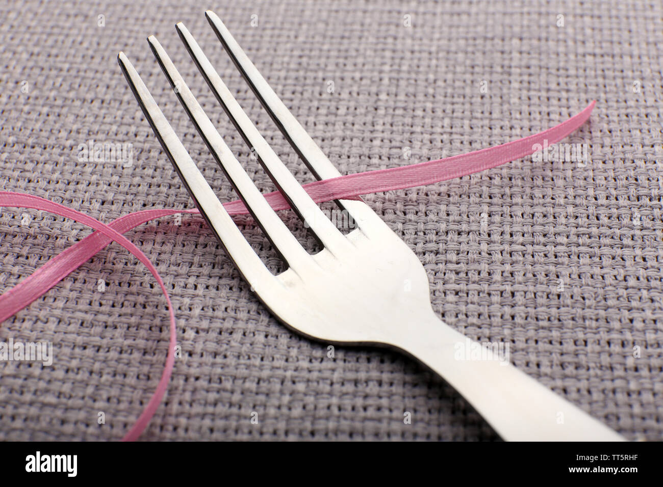 Stages of tying bow on fork, close-up Stock Photo - Alamy