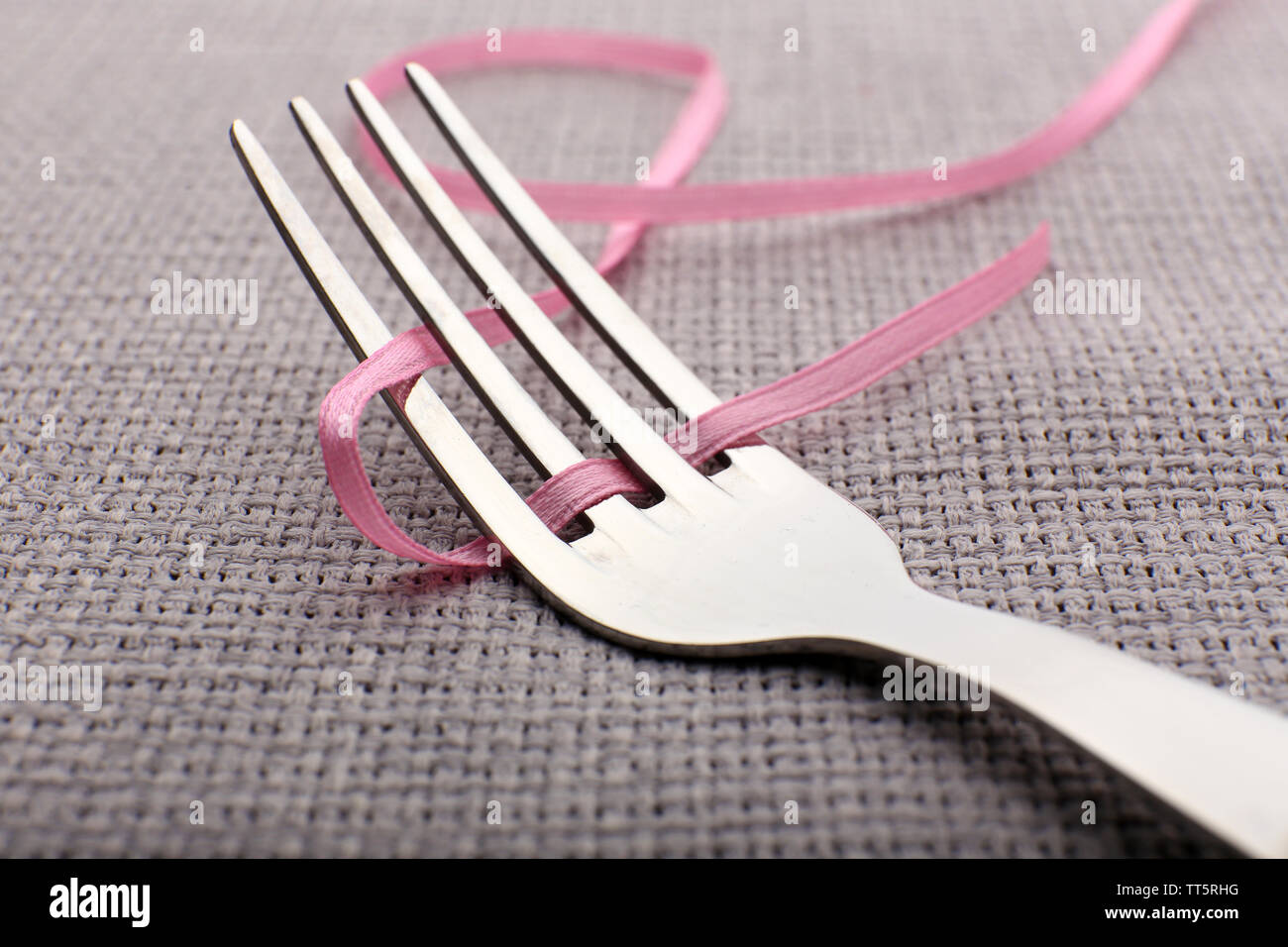 Stages of tying bow on fork, close-up Stock Photo - Alamy