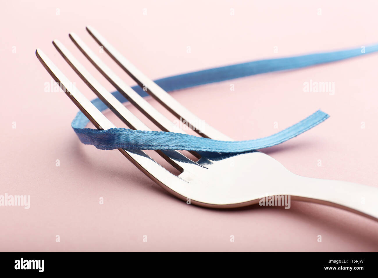Stages of tying bow on fork, close-up Stock Photo - Alamy