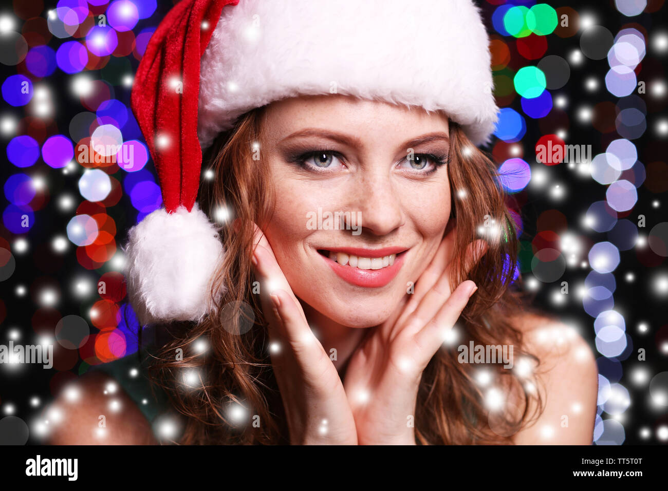 Portrait of beautiful young woman on bright lights background Stock ...
