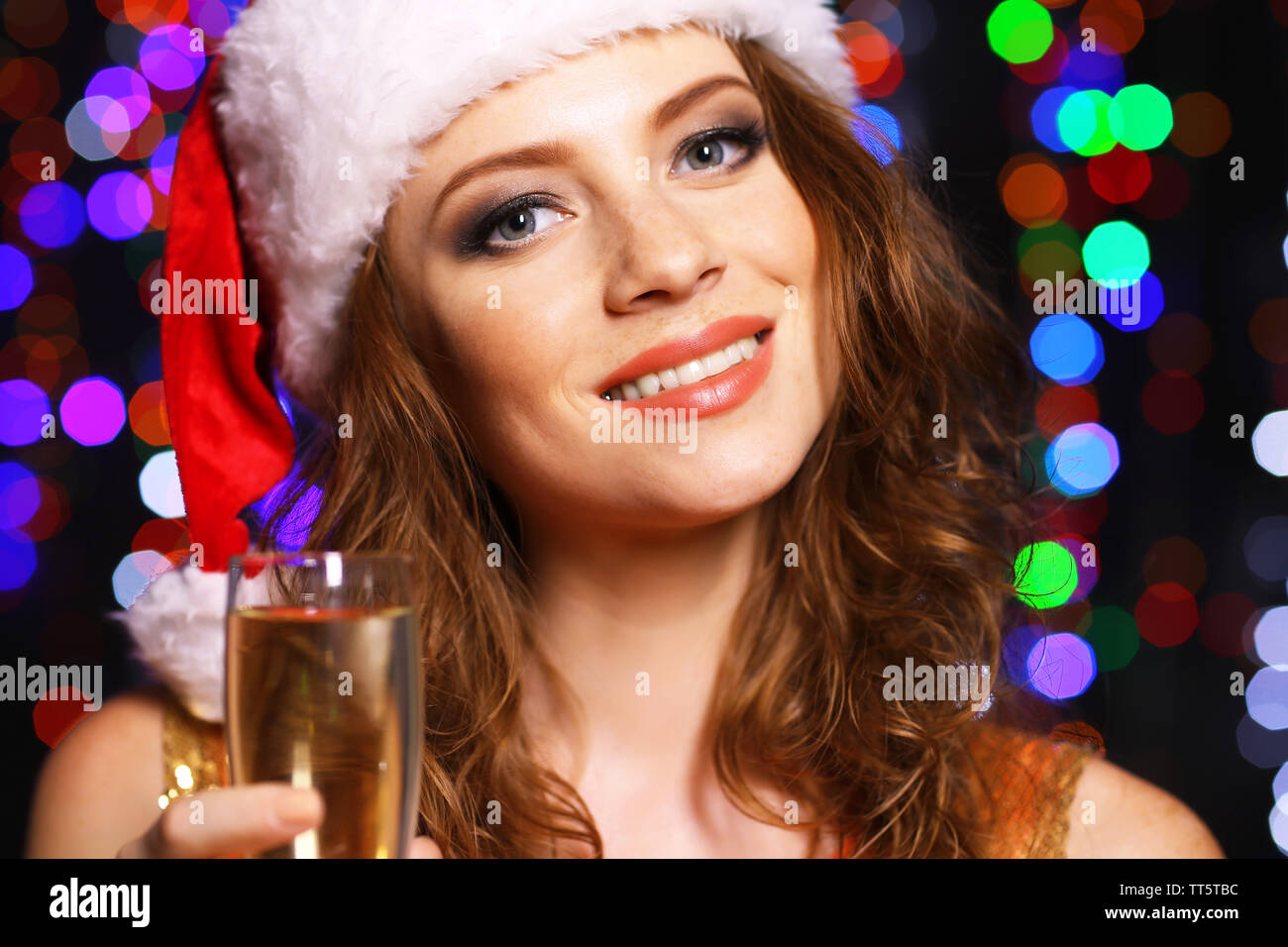 Portrait of beautiful young woman on bright lights background Stock ...