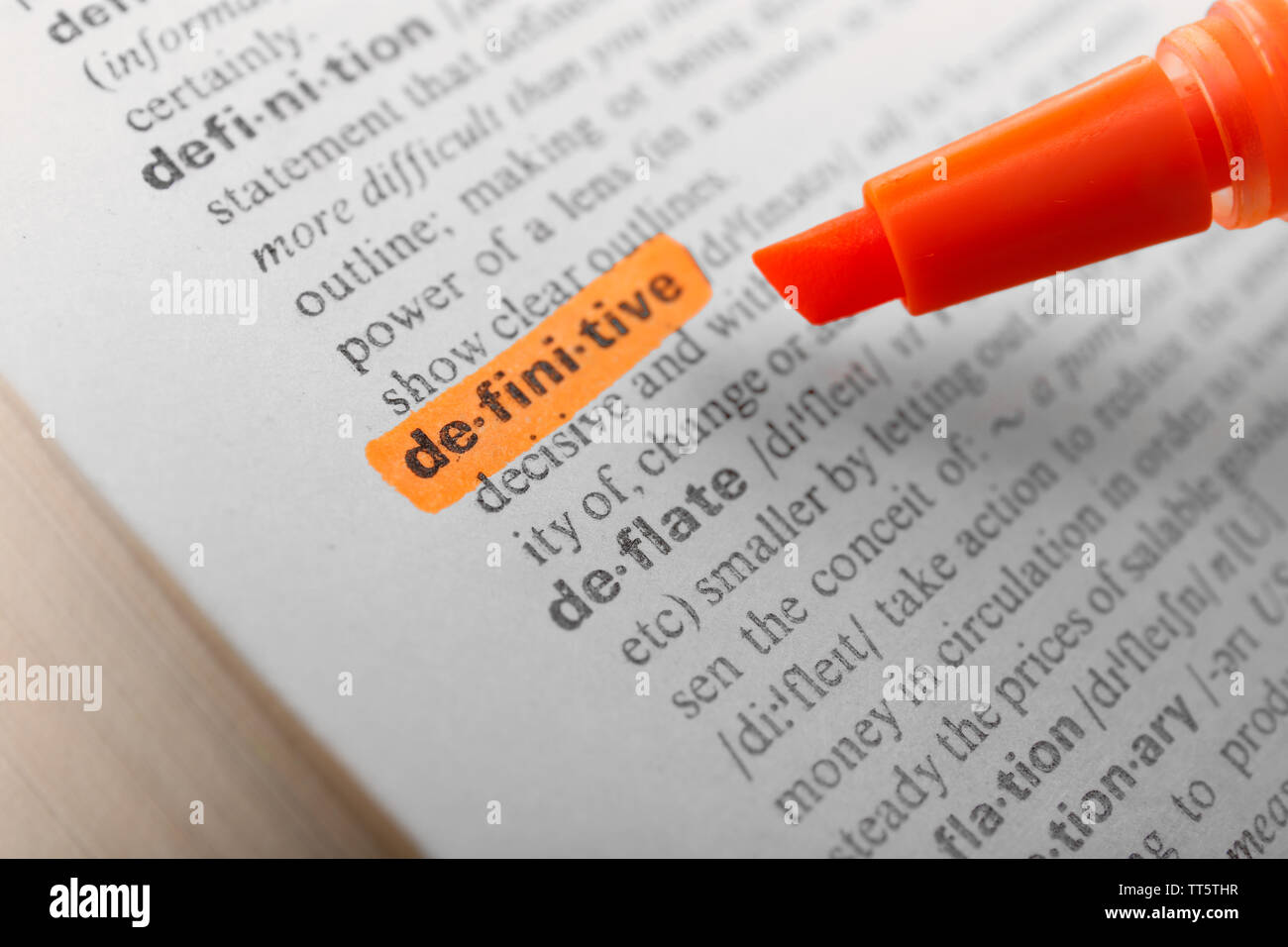 Orange marker highlighting word in dictionary Stock Photo - Alamy