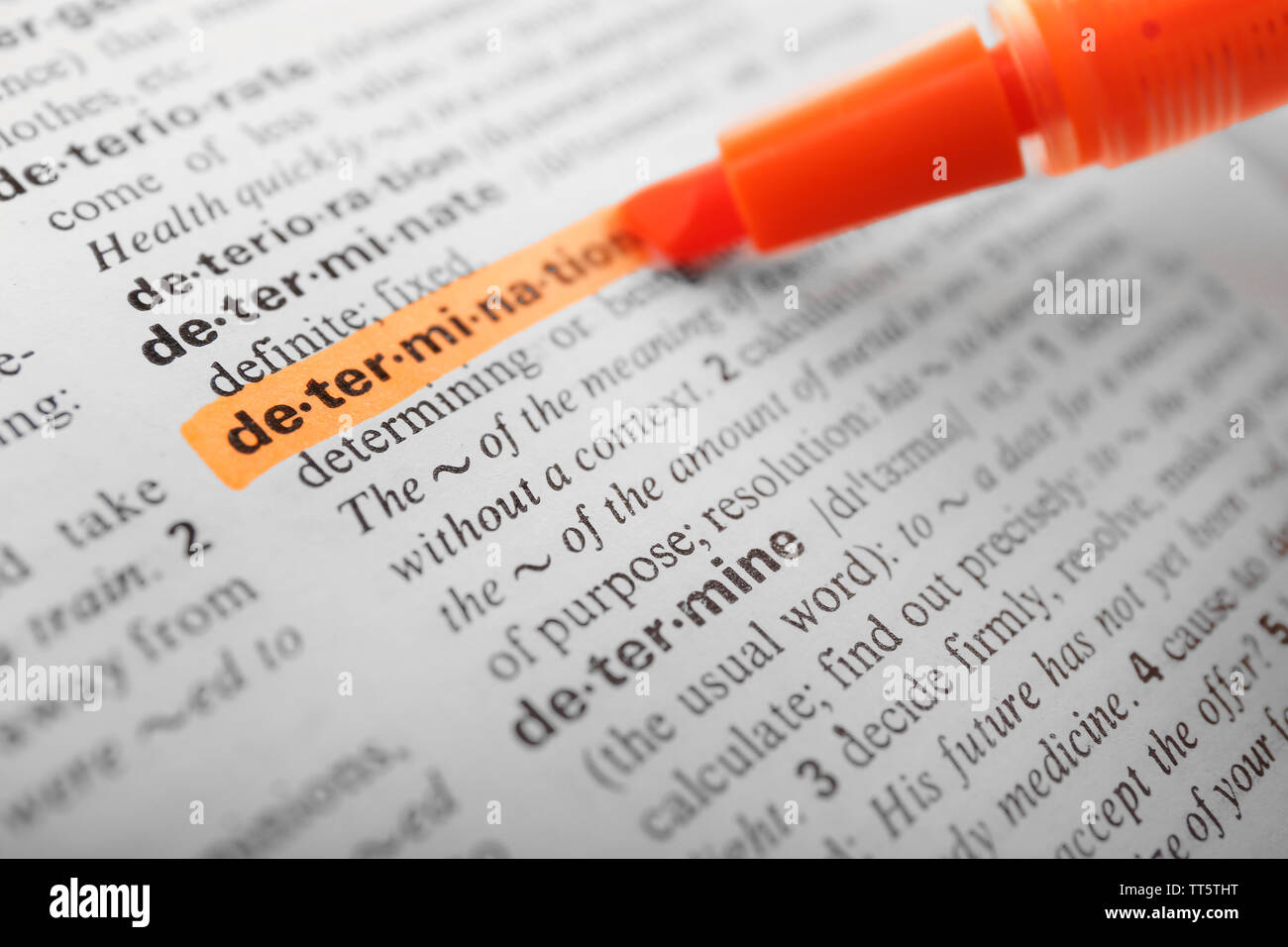 Orange marker highlighting word in dictionary Stock Photo - Alamy
