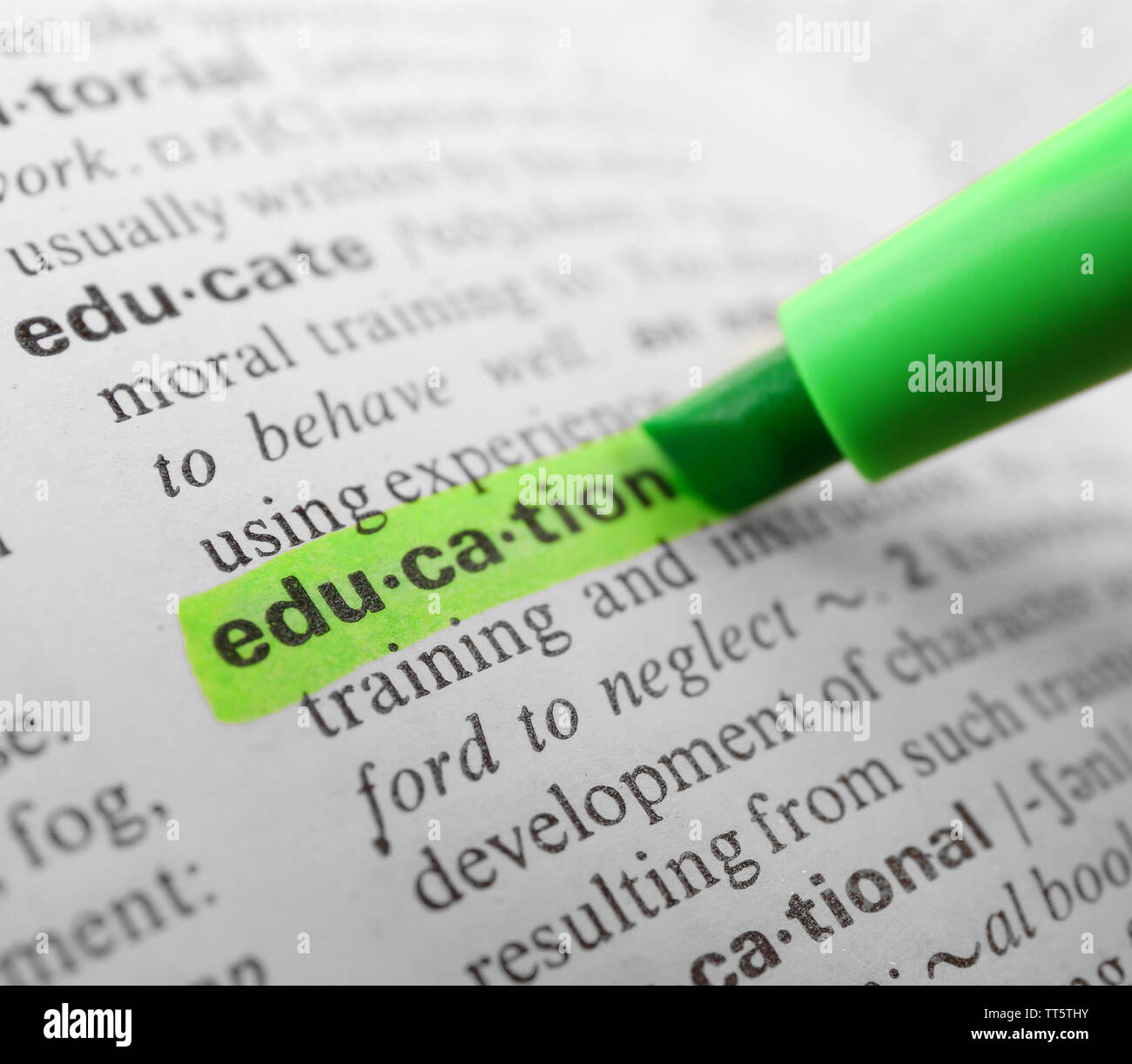 Green marker highlighting word in dictionary Stock Photo - Alamy