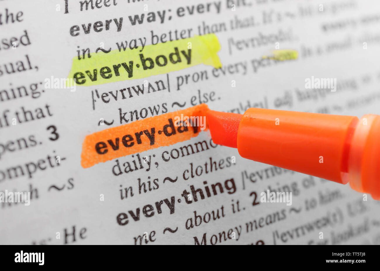 Orange marker highlighting word in dictionary Stock Photo - Alamy