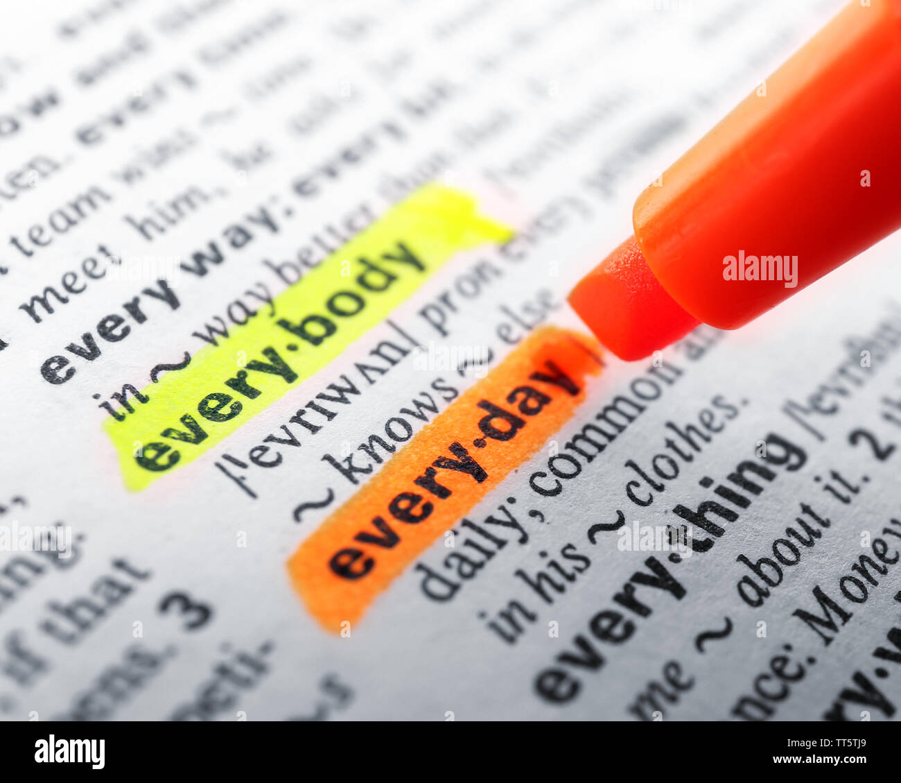 Orange marker highlighting word in dictionary Stock Photo - Alamy