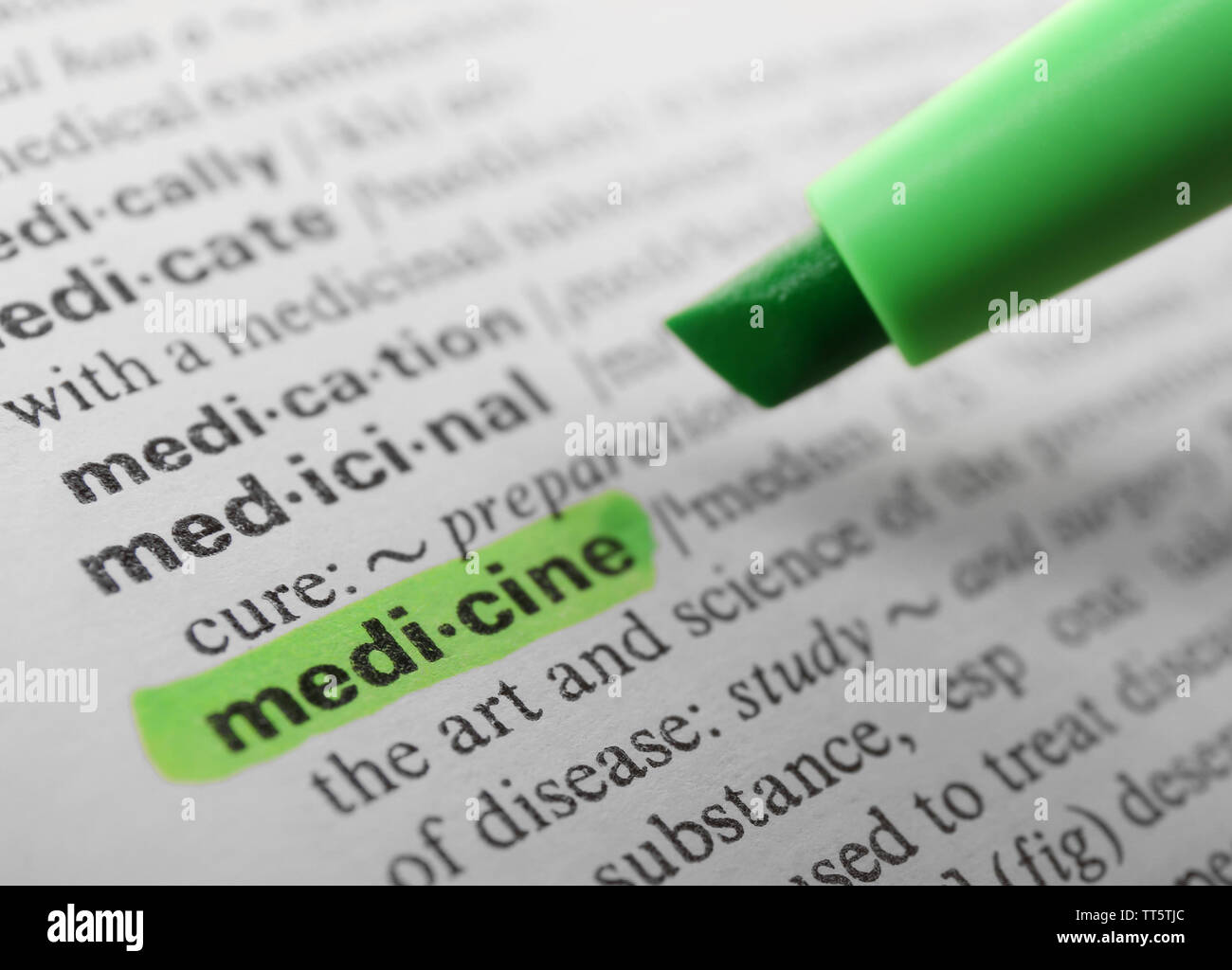 Green marker highlighting word in dictionary Stock Photo - Alamy