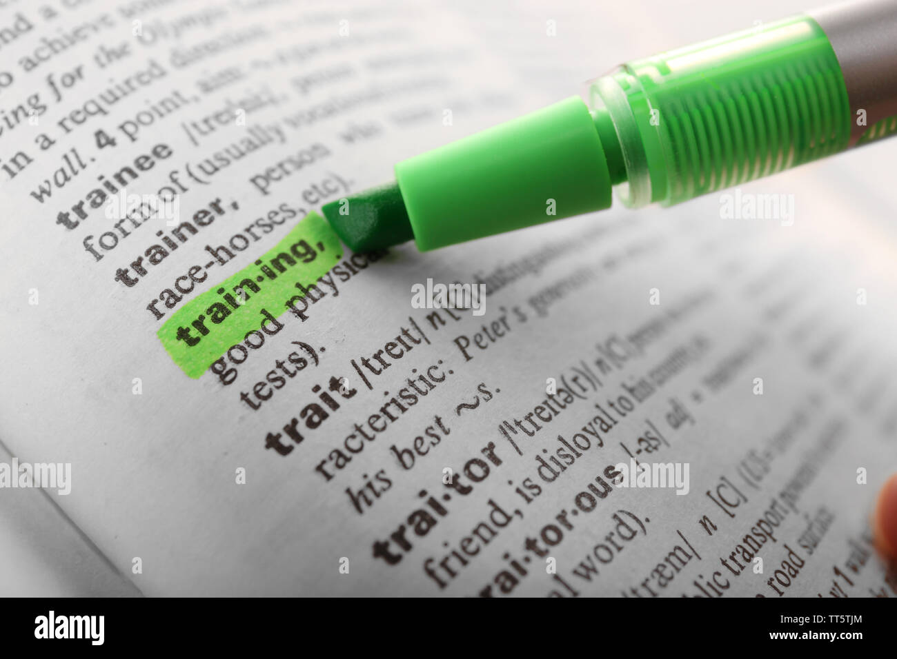 Green marker highlighting word in dictionary Stock Photo - Alamy