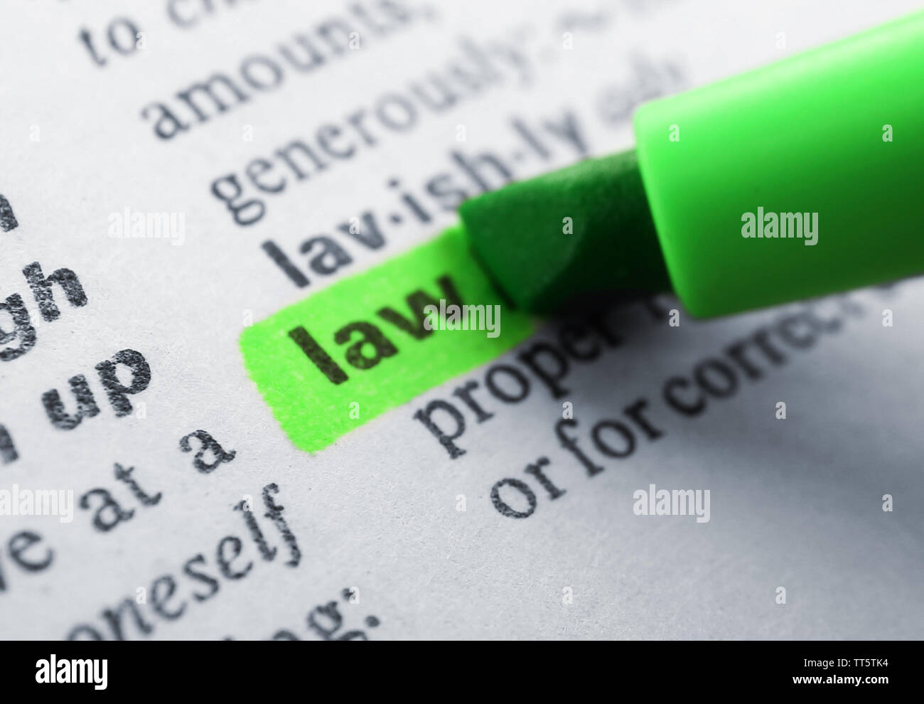 Green marker highlighting word in dictionary Stock Photo - Alamy