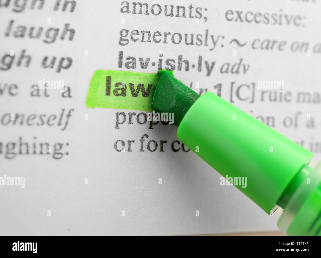 Green marker highlighting word in dictionary Stock Photo - Alamy
