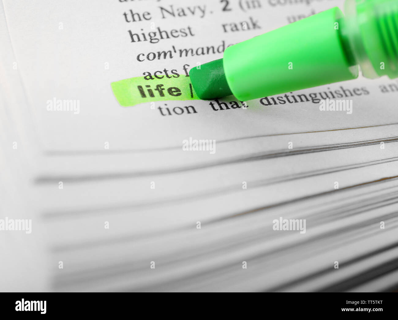 Green marker highlighting word in dictionary Stock Photo - Alamy