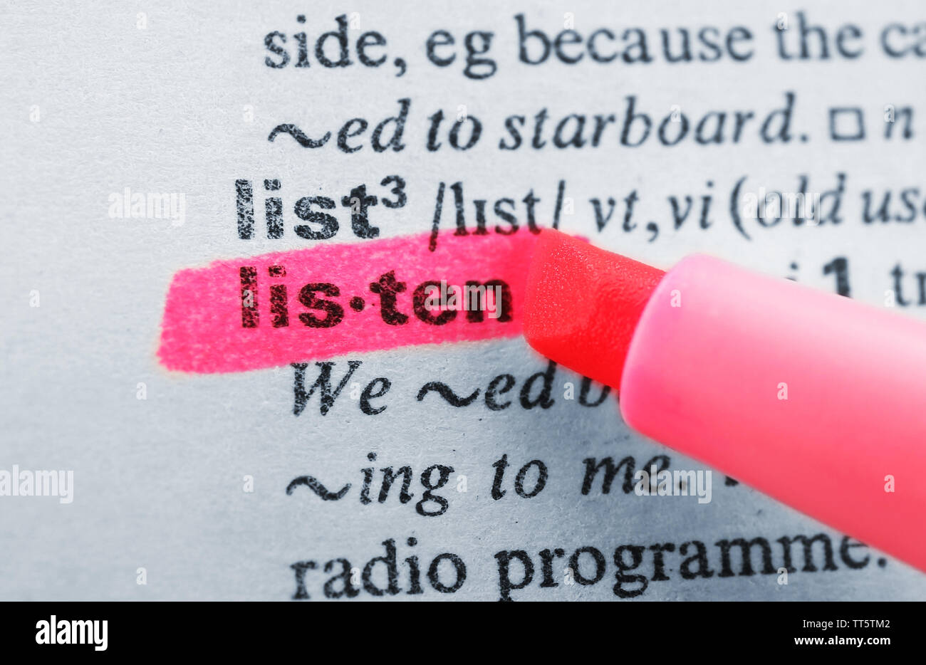 Pink marker highlighting word in dictionary Stock Photo - Alamy