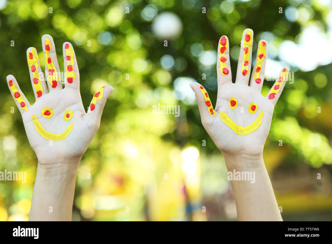 Smiling colorful hands on natural background Stock Photo - Alamy