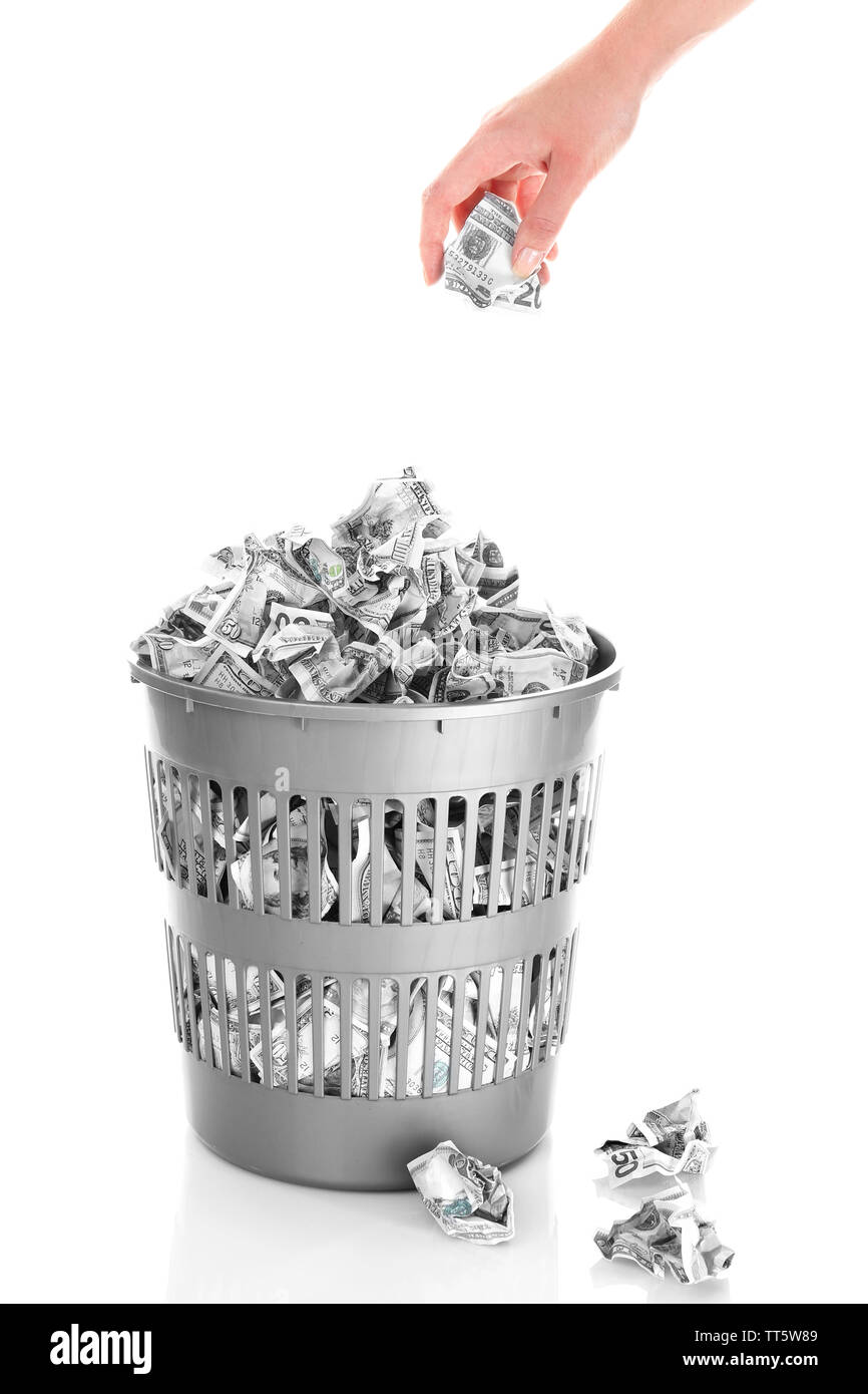 Hand throwing money into trash can isolated on white Stock Photo - Alamy