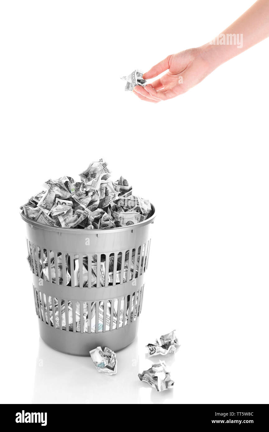 Hand throwing money into trash can isolated on white Stock Photo - Alamy