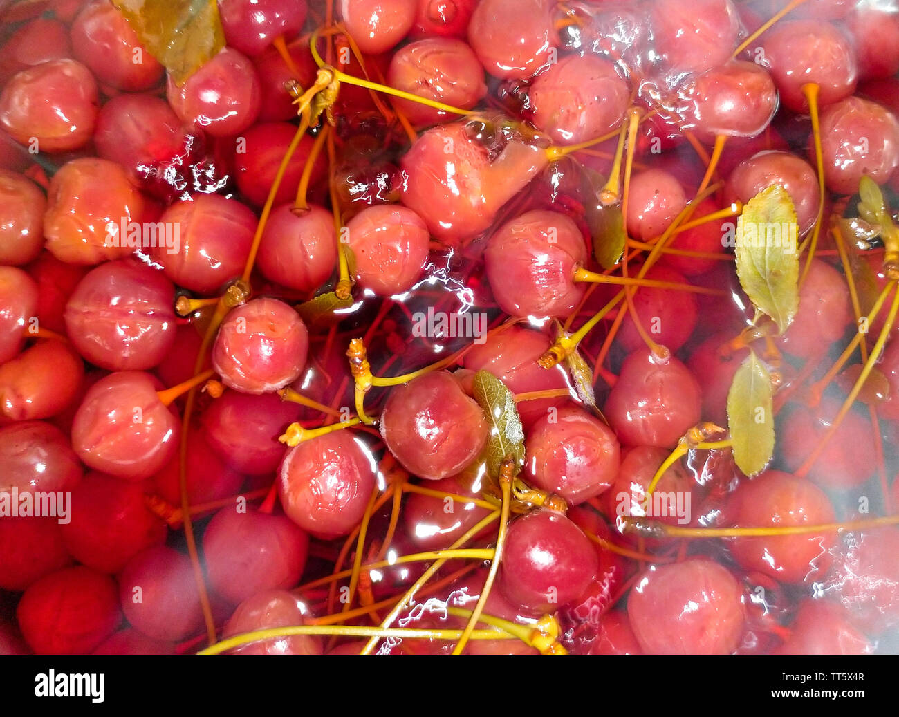 cherry composting boiling harvest festival Stock Photo - Alamy