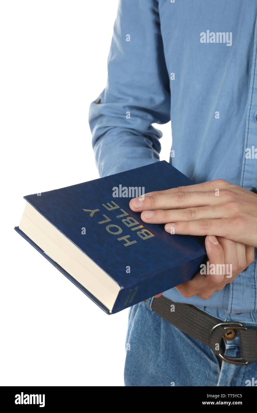 Man holding Bible isolated on white Stock Photo - Alamy