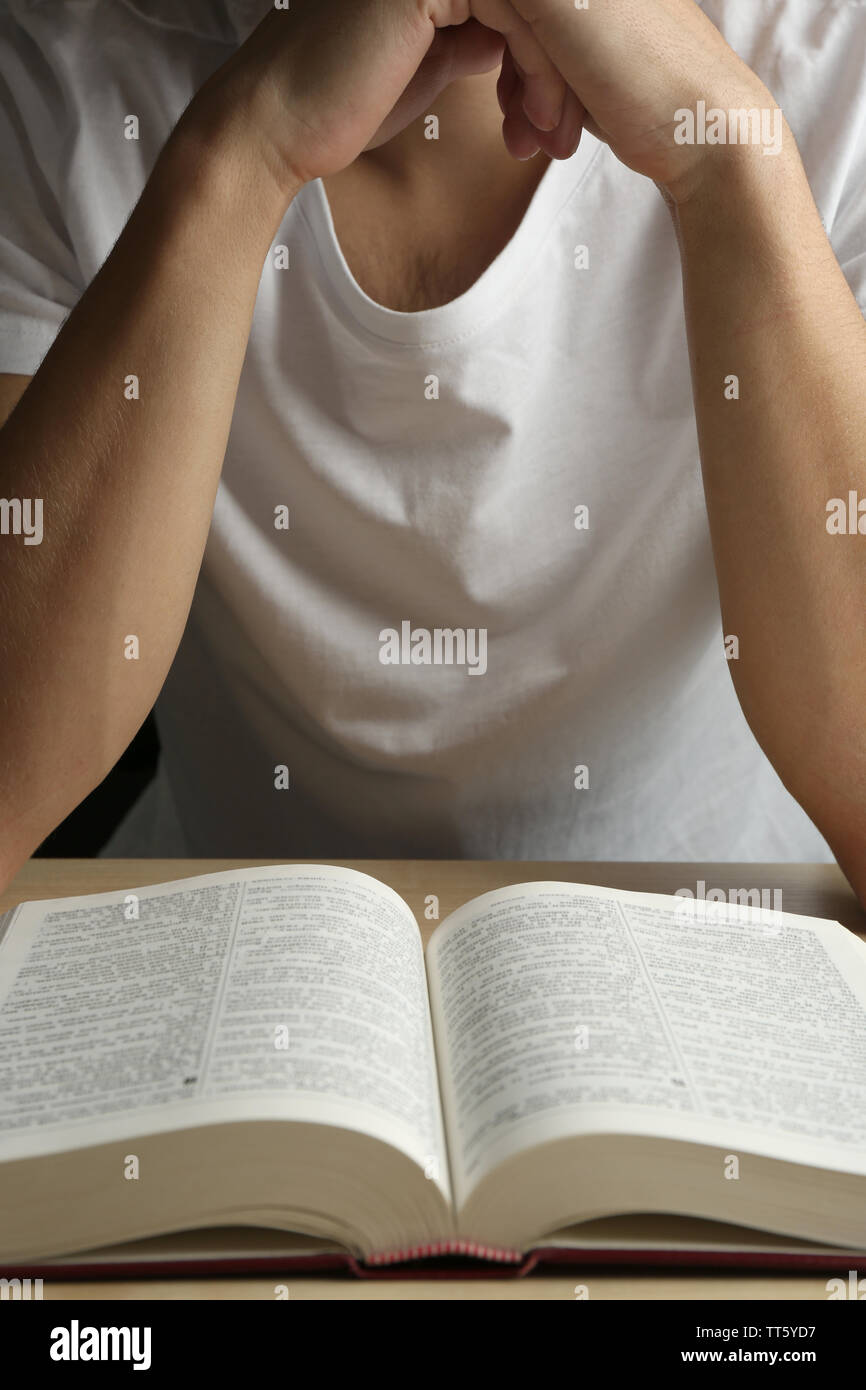 Church father reading bible hi-res stock photography and images - Alamy