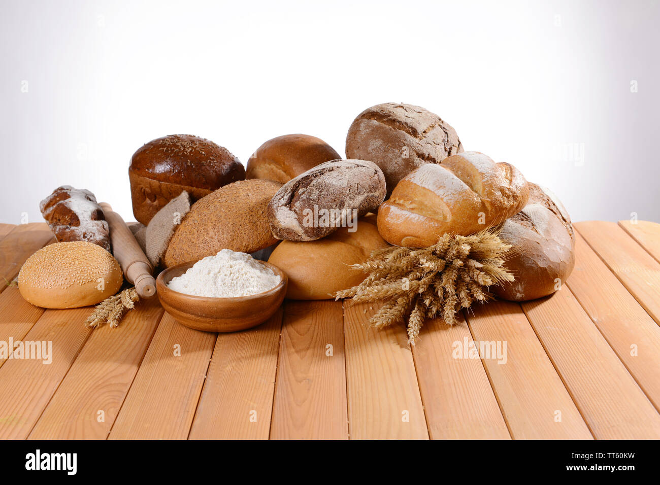 Fresh bread on table on white background Stock Photo - Alamy