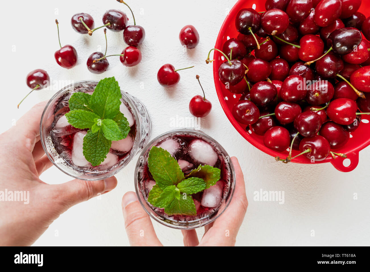 Fresh Cherry Juice in a Glass With Mint Leaves and Ice Close Up on ...