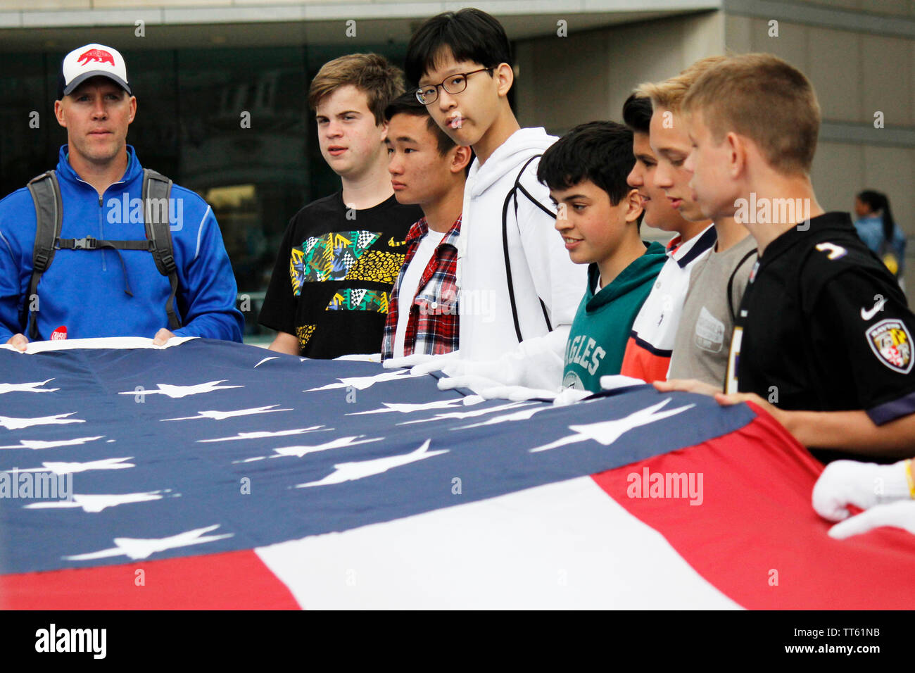 Philadelphia, PA, USA - June 14, 2019: Students work together to fold a ...