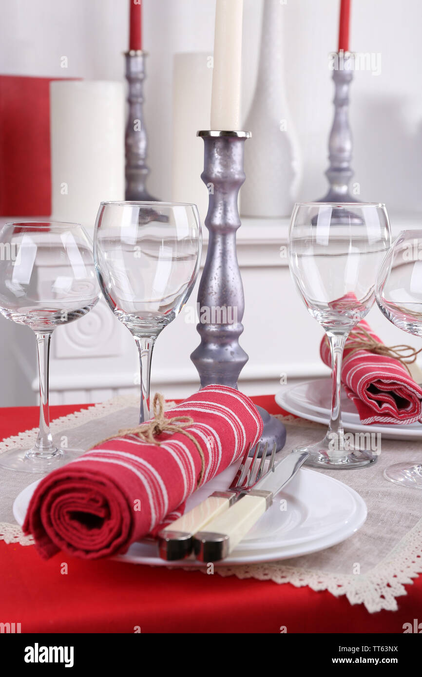 Festive table setting on room background Stock Photo - Alamy