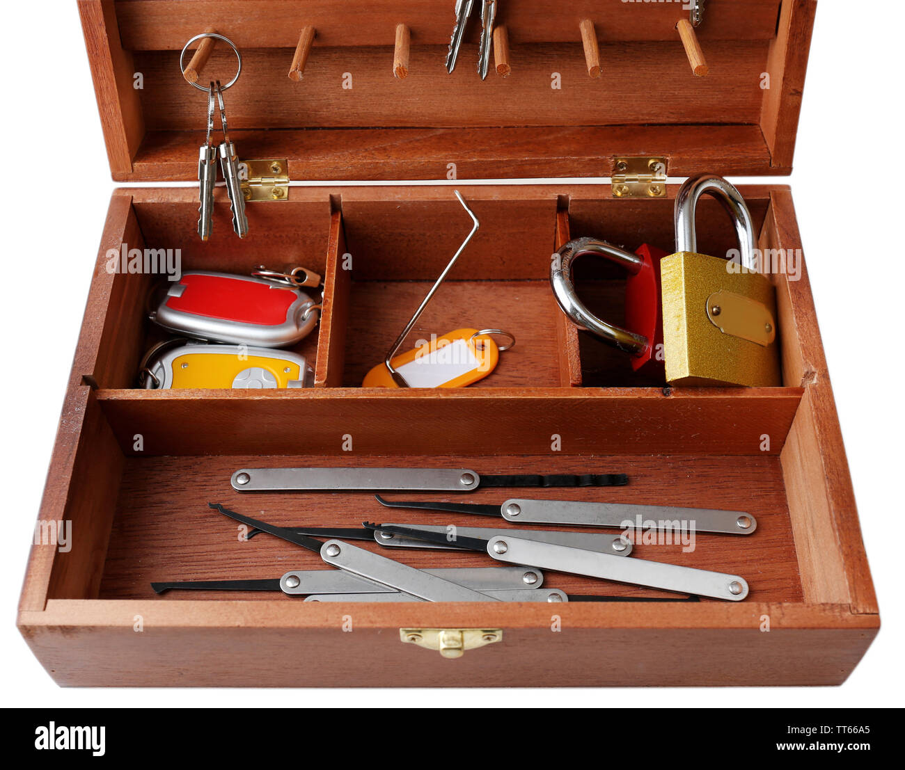 Set of keys and lock picks in wooden box isolated on white Stock Photo ...