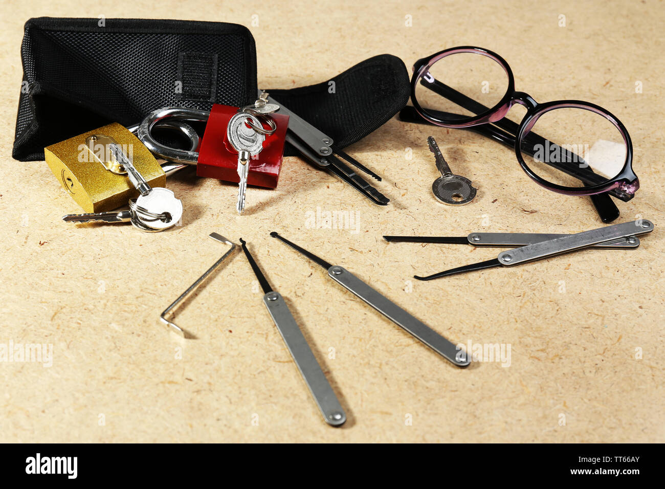 Set of locks, keys and lock picks on wooden background Stock Photo - Alamy