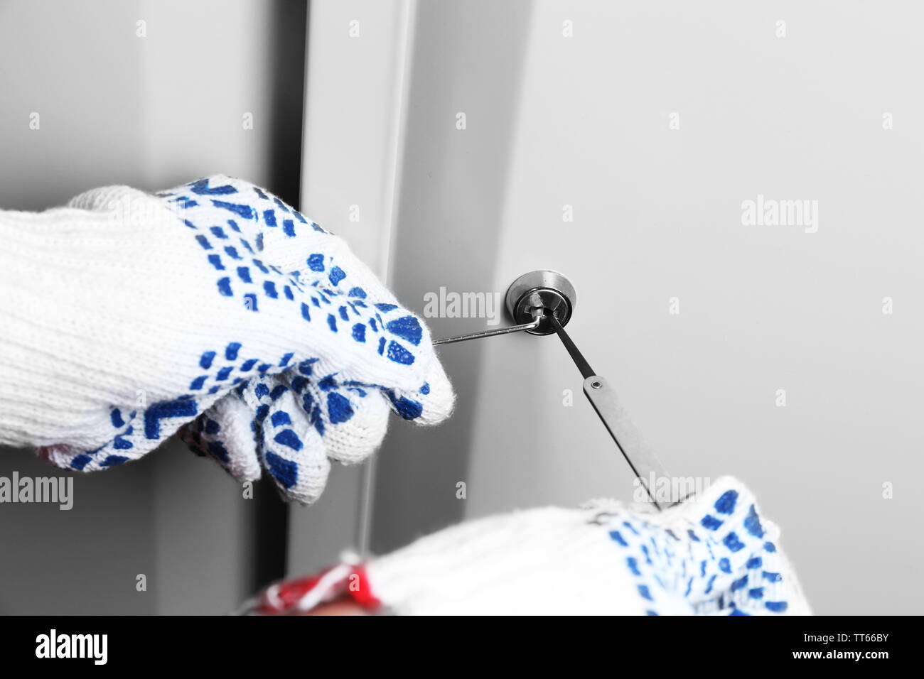 Picking a lock Stock Photo - Alamy