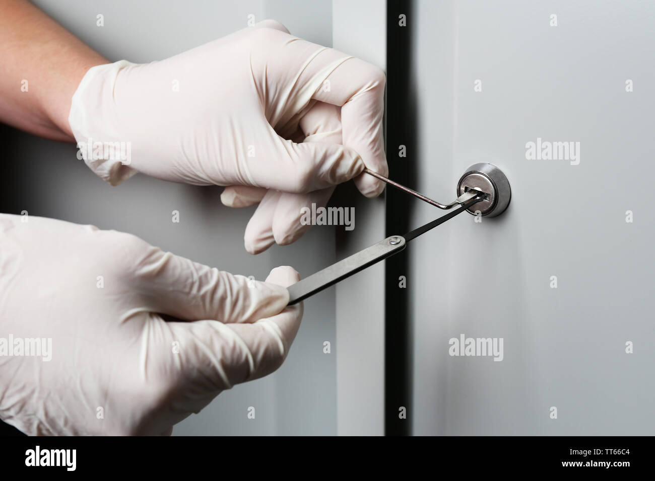 Picking a lock Stock Photo - Alamy