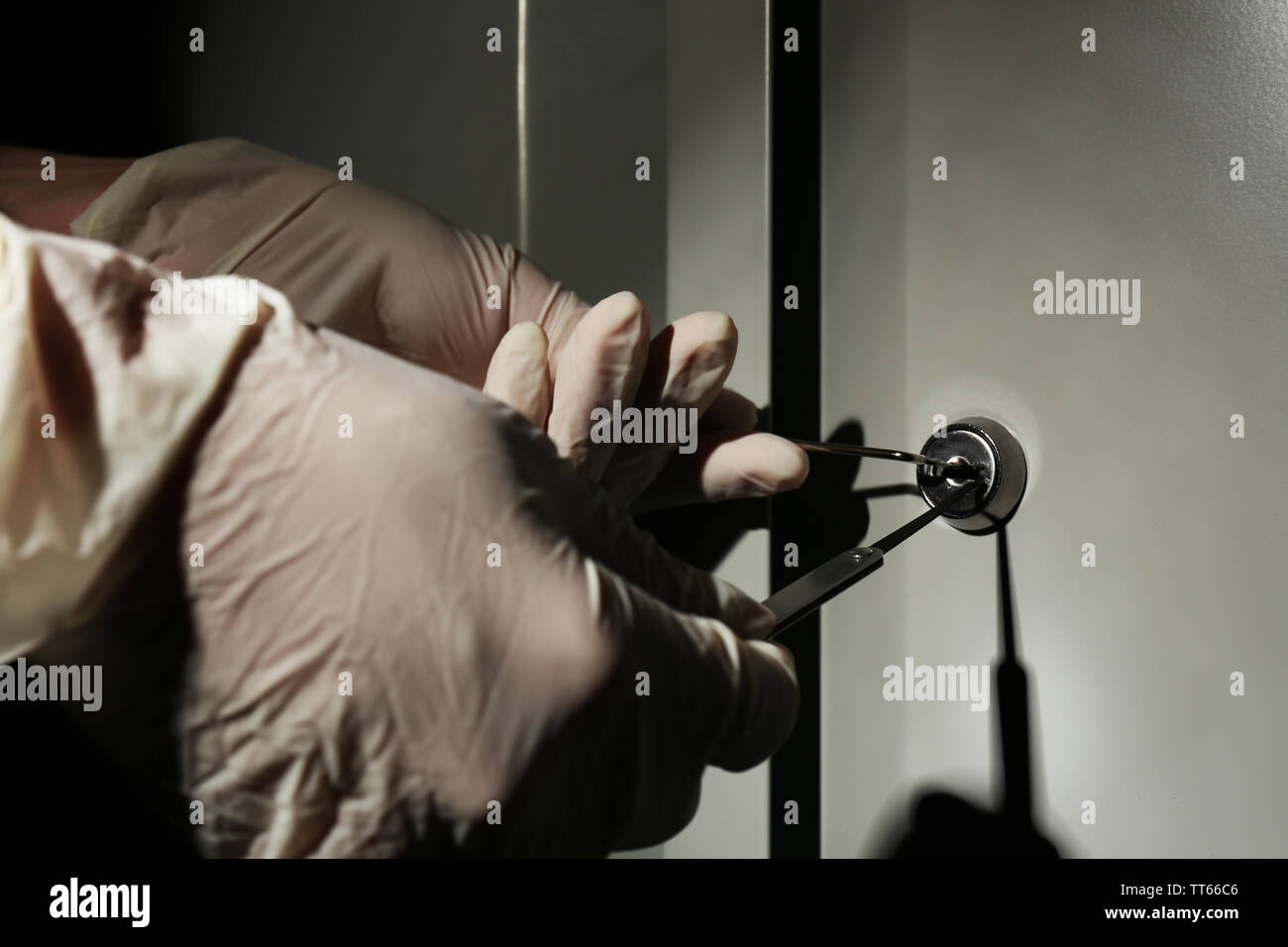Picking a lock Stock Photo - Alamy