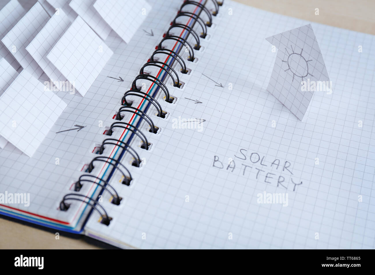 Applique paper with building and solar panels in notebook Stock Photo ...